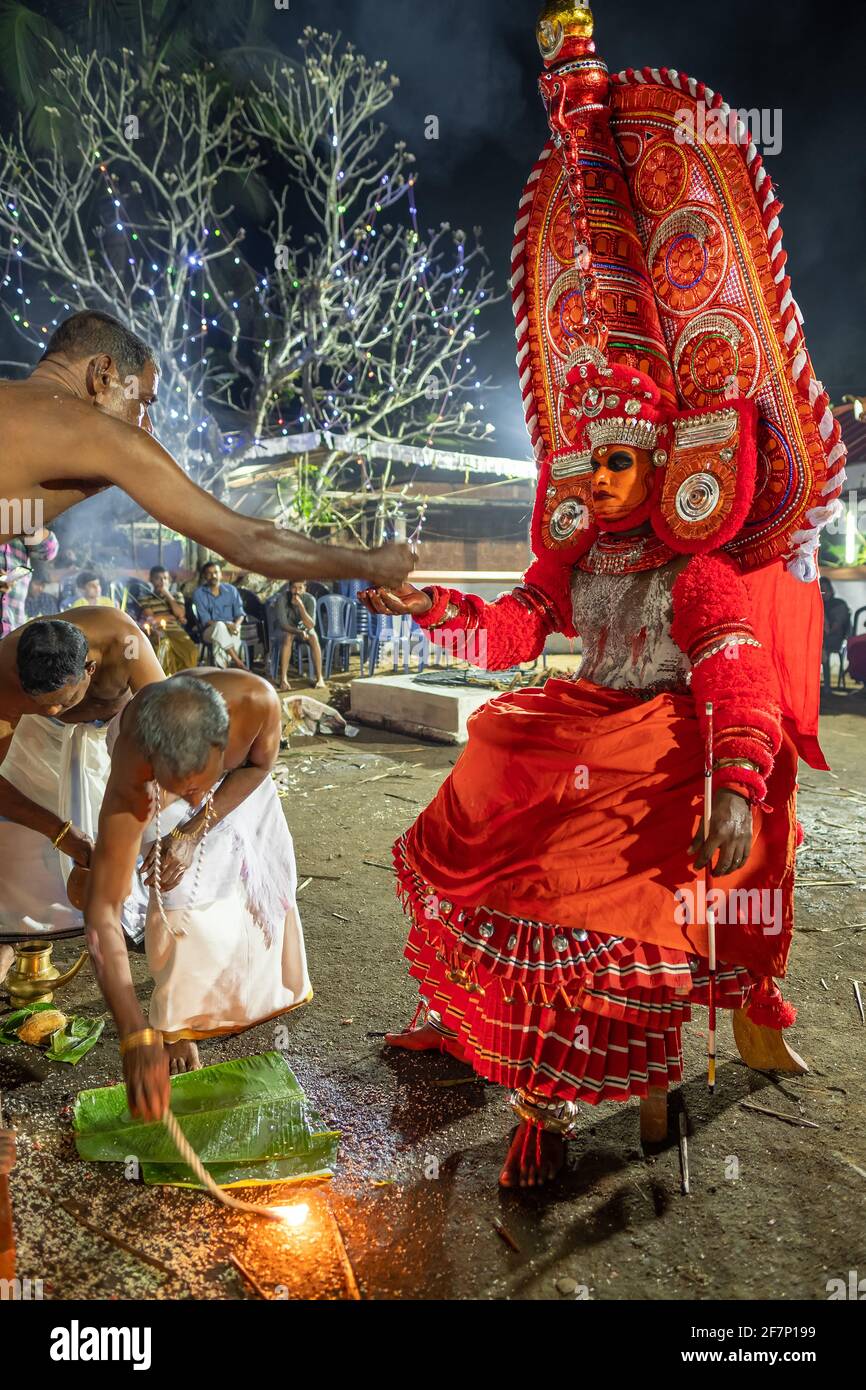 Payyanur, India - December 5, 2019: Theyyam artist perform with fire ...