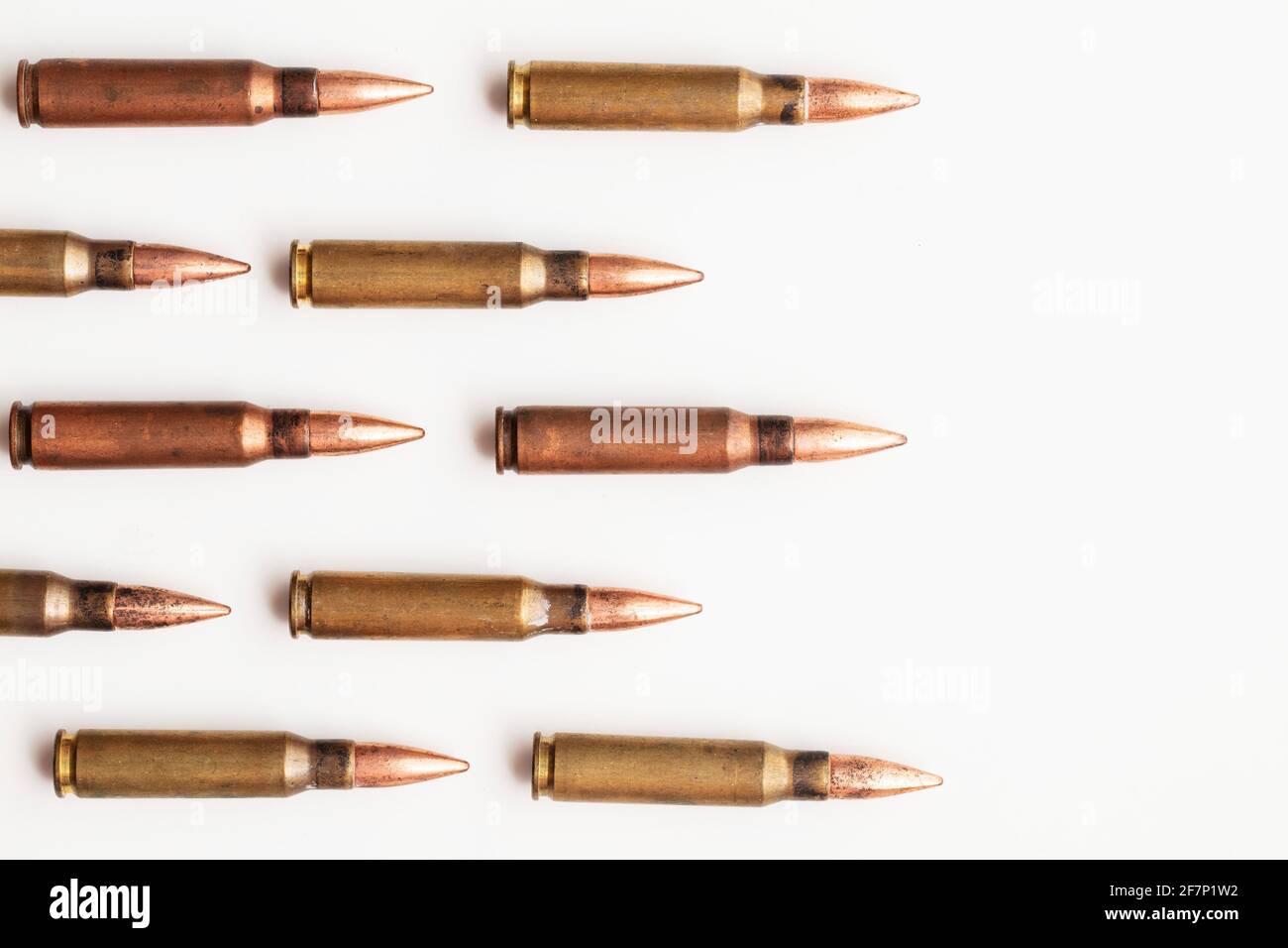 A group of bullet ammunition shells on a white background Stock Photo ...