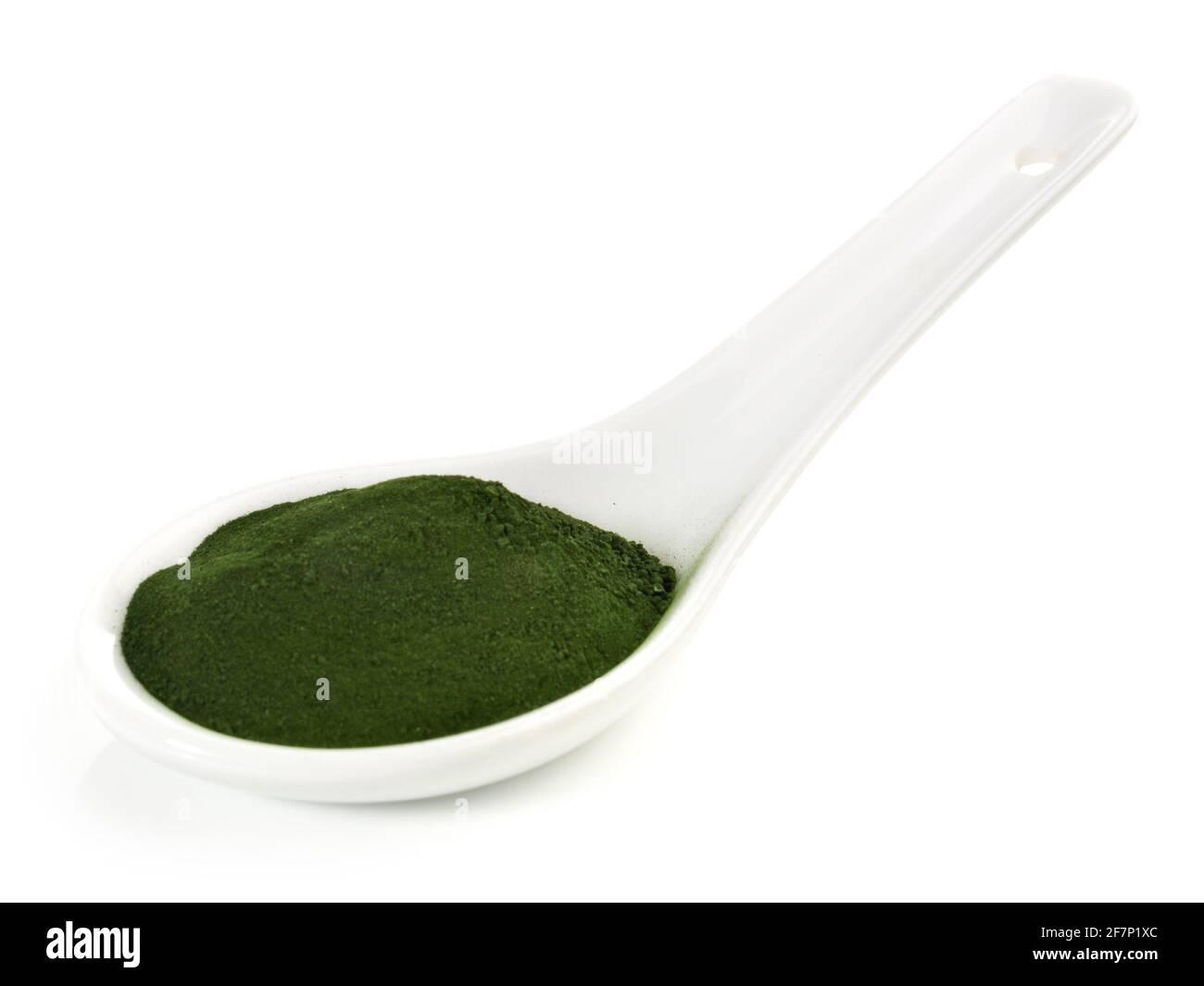Chlorella Powder on a Spoon isolated on white Background Stock Photo ...