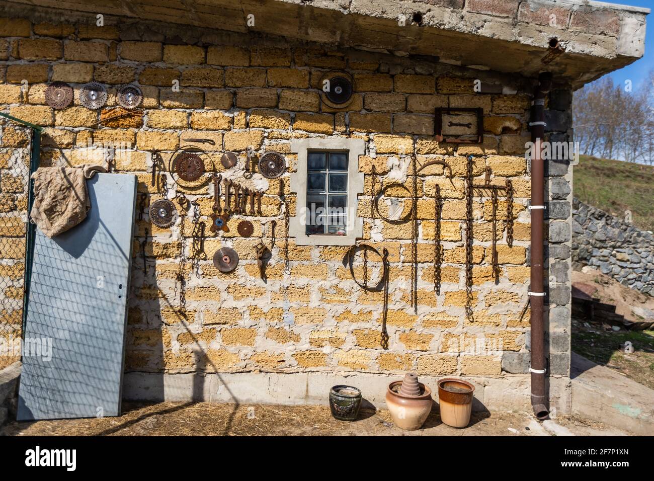 Old tools and wheels in a barn Stock Photo - Alamy