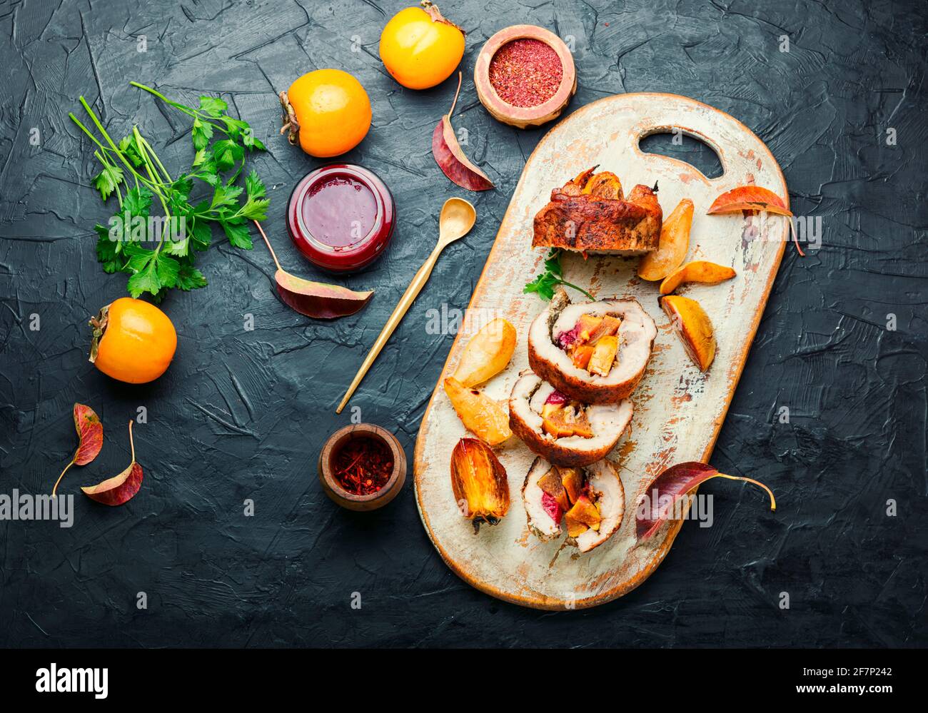 Baked pork roll with autumn persimmon.Meat stuffed with fruits Stock ...
