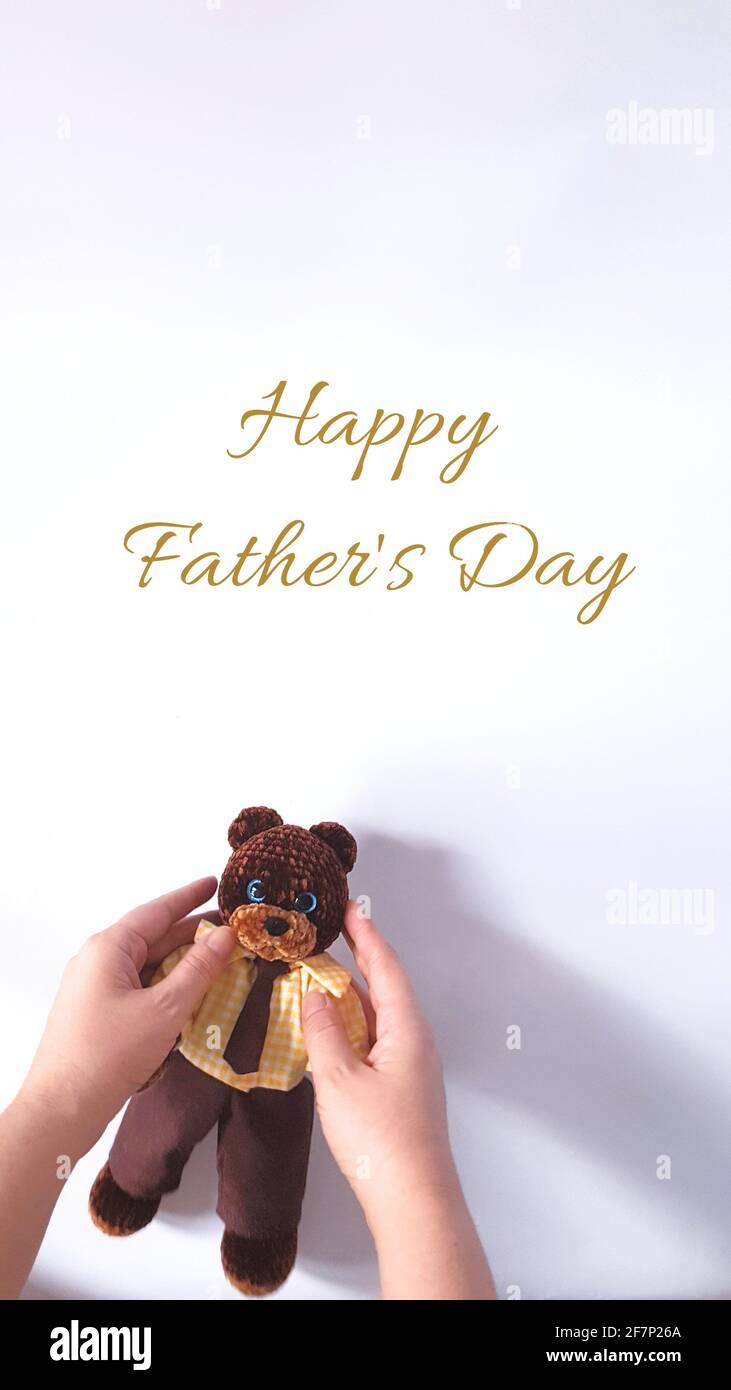 Happy Father's Day greeting card. Plush crochet teddy bear in a suit ...