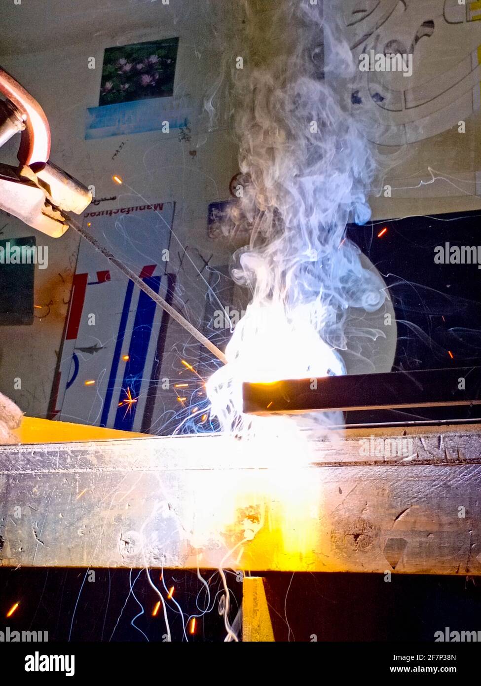 Man Welding At Night Stock Photo - Alamy