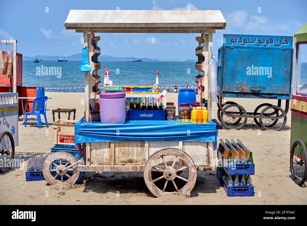 Vintage food carts lining up on the beach as a novelty attraction ...