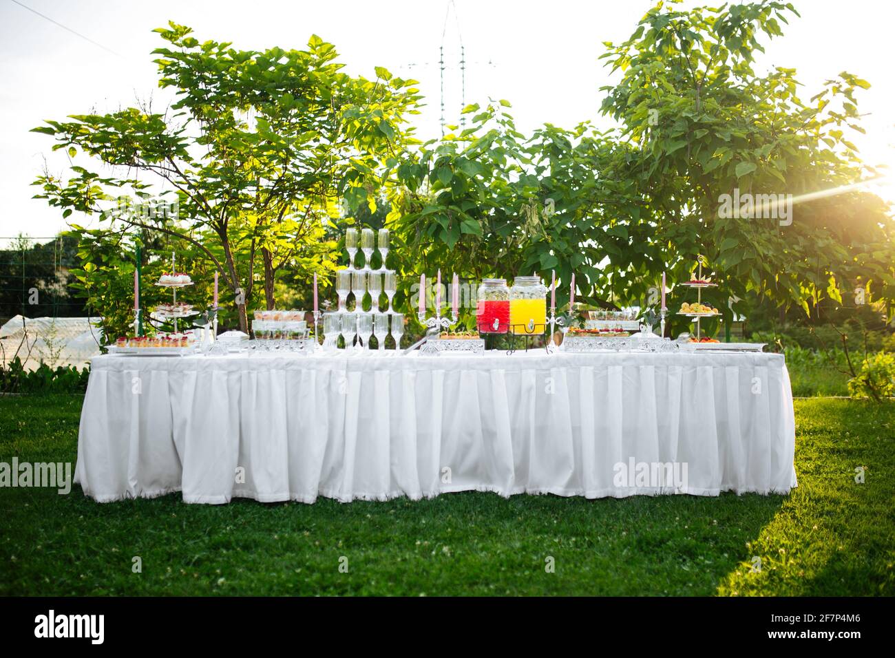 Outdoor festive banquet table set with appetizers Stock Photo - Alamy