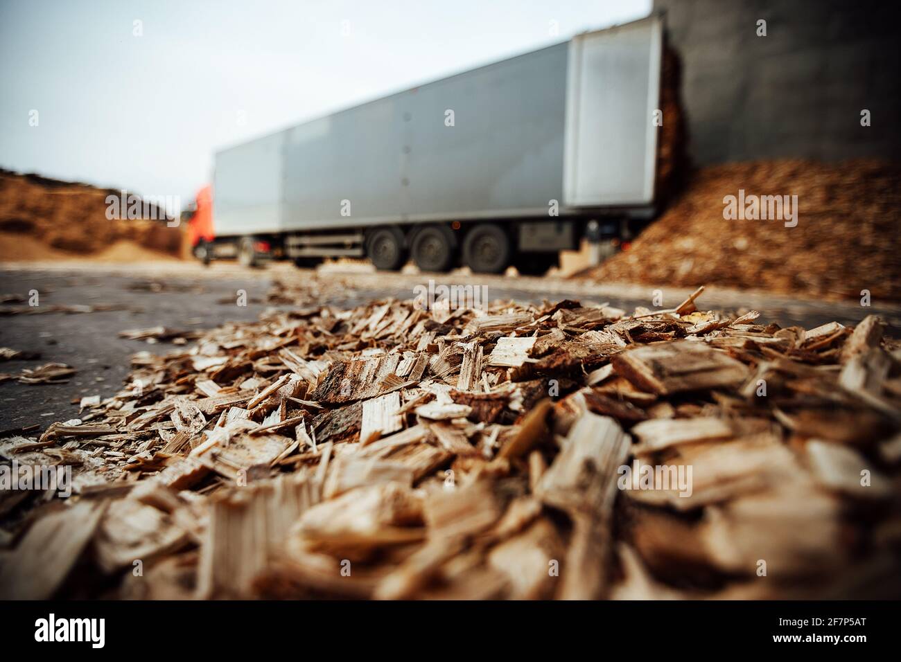 the truck unloads tons of wood waste. sawdust and shavings are stored ...