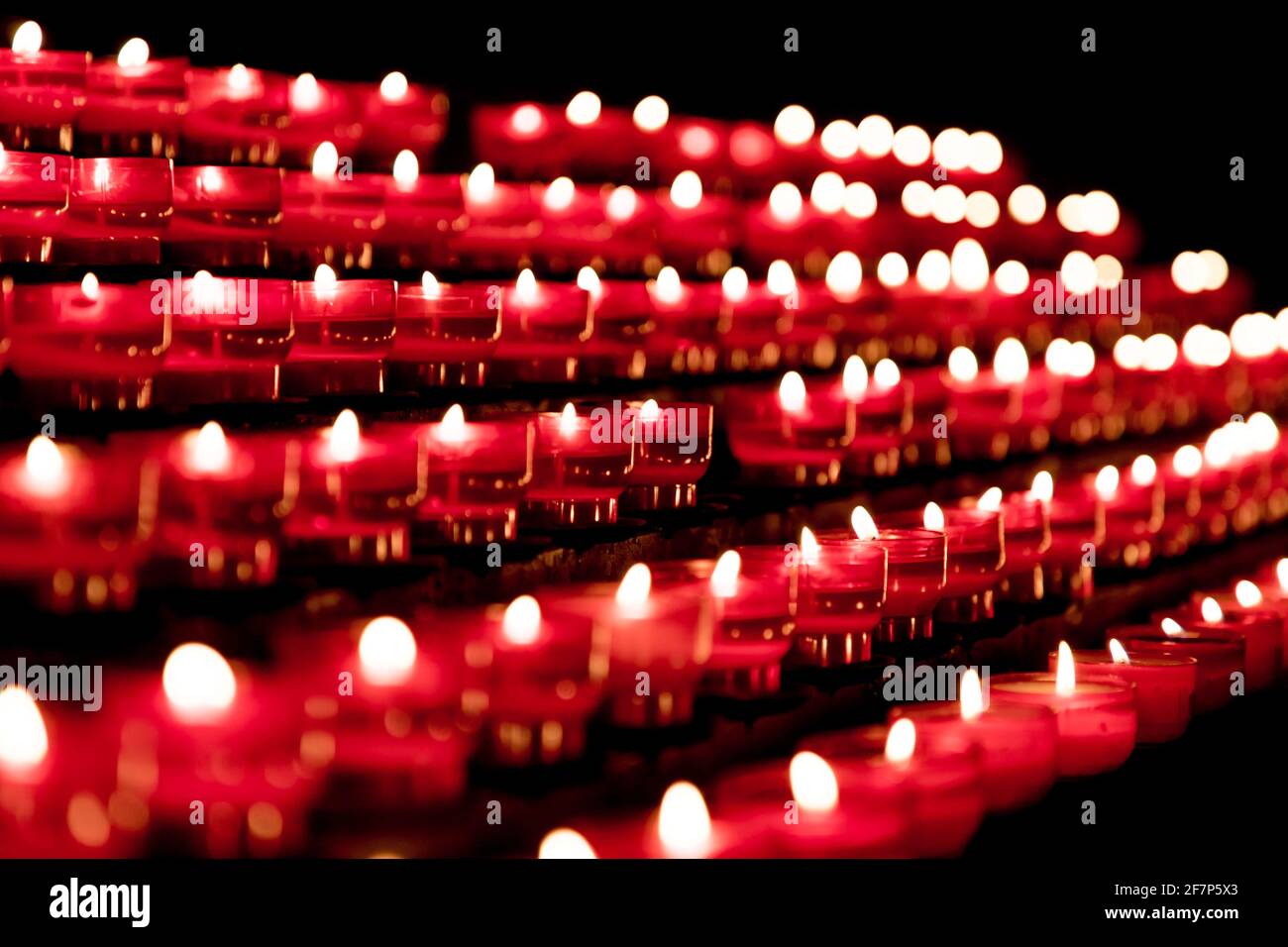 Group of red candles in church for faith resurrection prayer ...