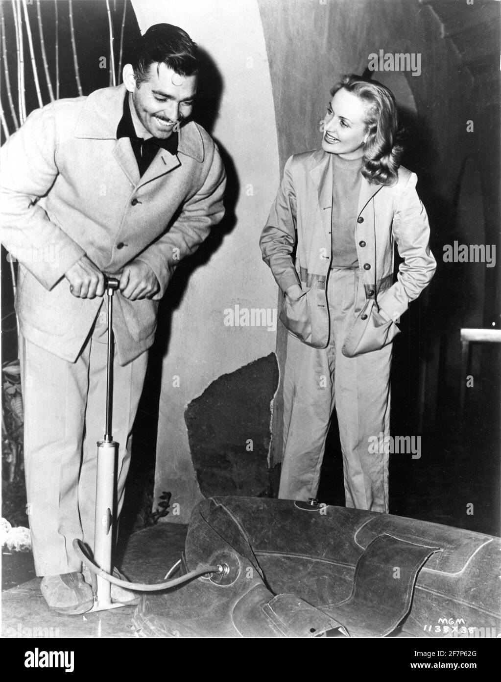 CLARK GABLE and his wife CAROLE LOMBARD preparing for a hunting trip at ...
