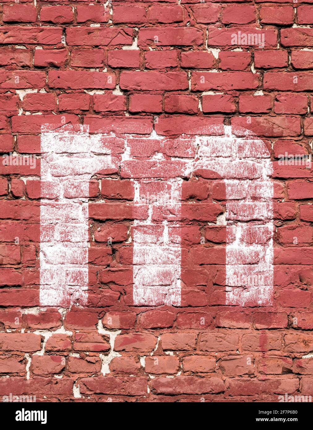 The letter m painted white on a red brick wall Stock Photo - Alamy