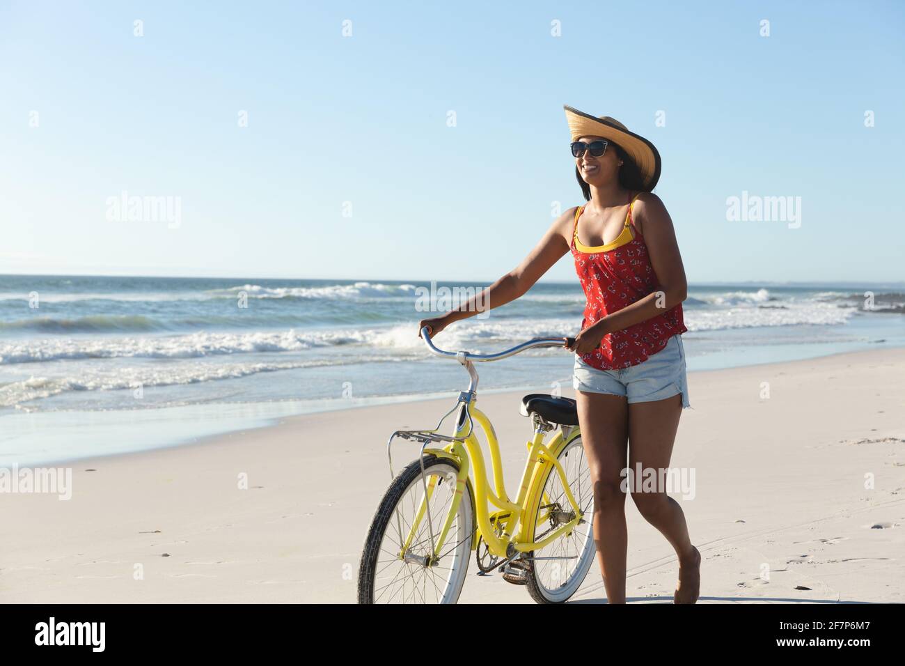 Woman walking her bicycle hi-res stock photography and images - Alamy
