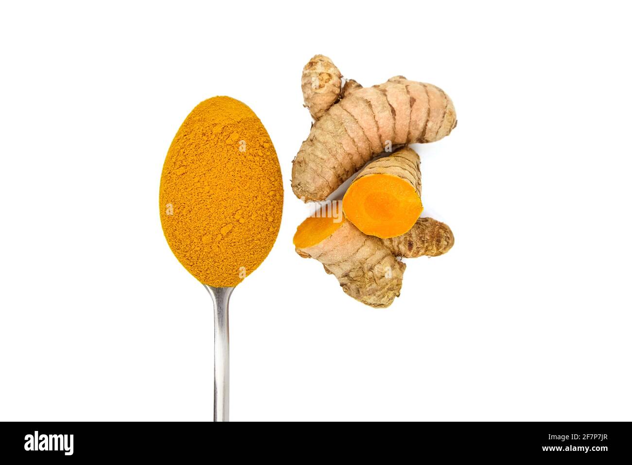 Curcuma roots and powder in spoon isolated on white background, top ...