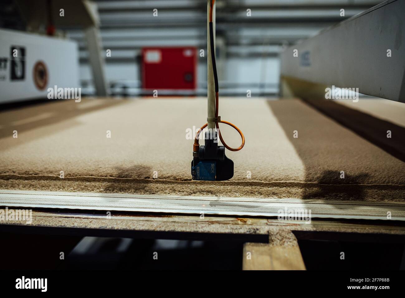 sawdust conveyor. the wood processing plant transports wood chips on a ...