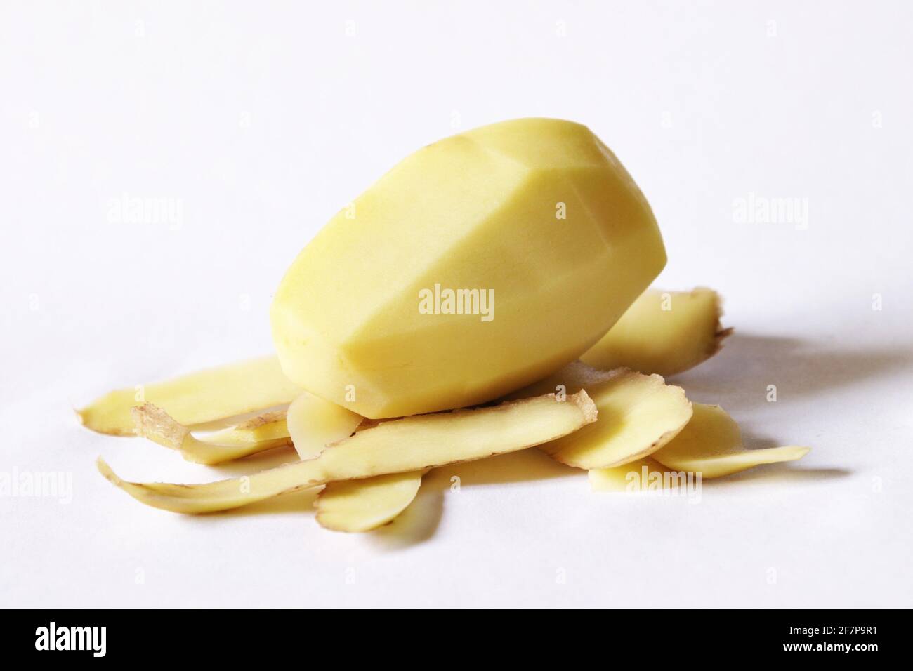 potato (Solanum tuberosum), freshly peeled potato, cut-out Stock Photo ...