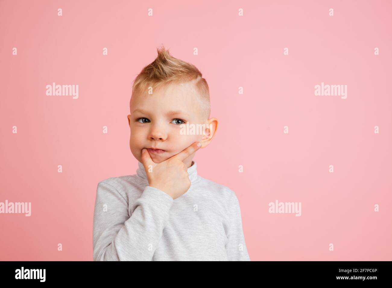 Happy boy isolated on pink studio background. Looks happy, cheerful ...