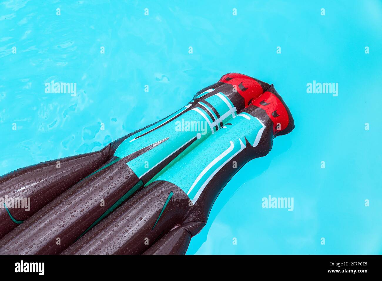 Coke shape inflatable Floating on water surface of a swimming pool ...