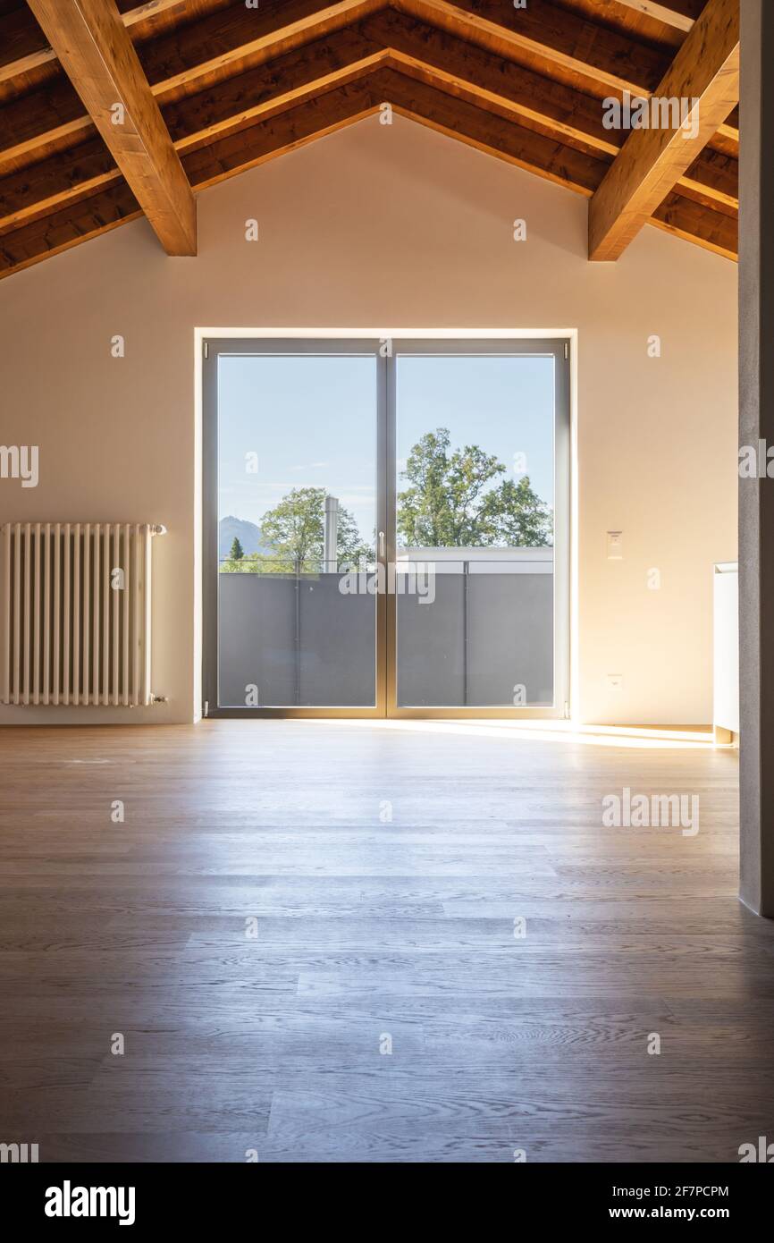 Front view empty room with large window to nature and blue sky. Nobody ...