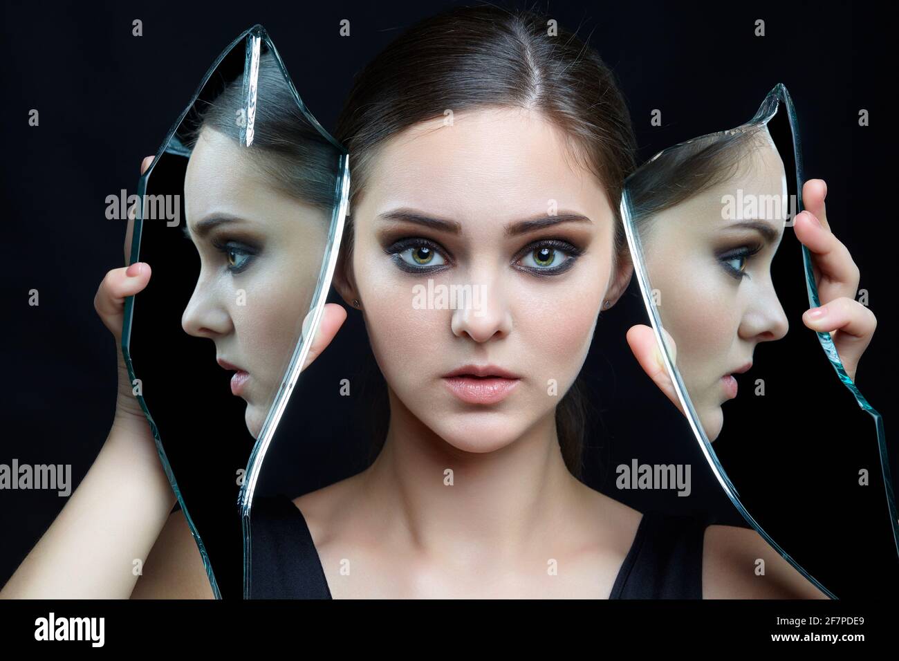 Girl with a shard of the mirror. Female with mirror shard in hand ...