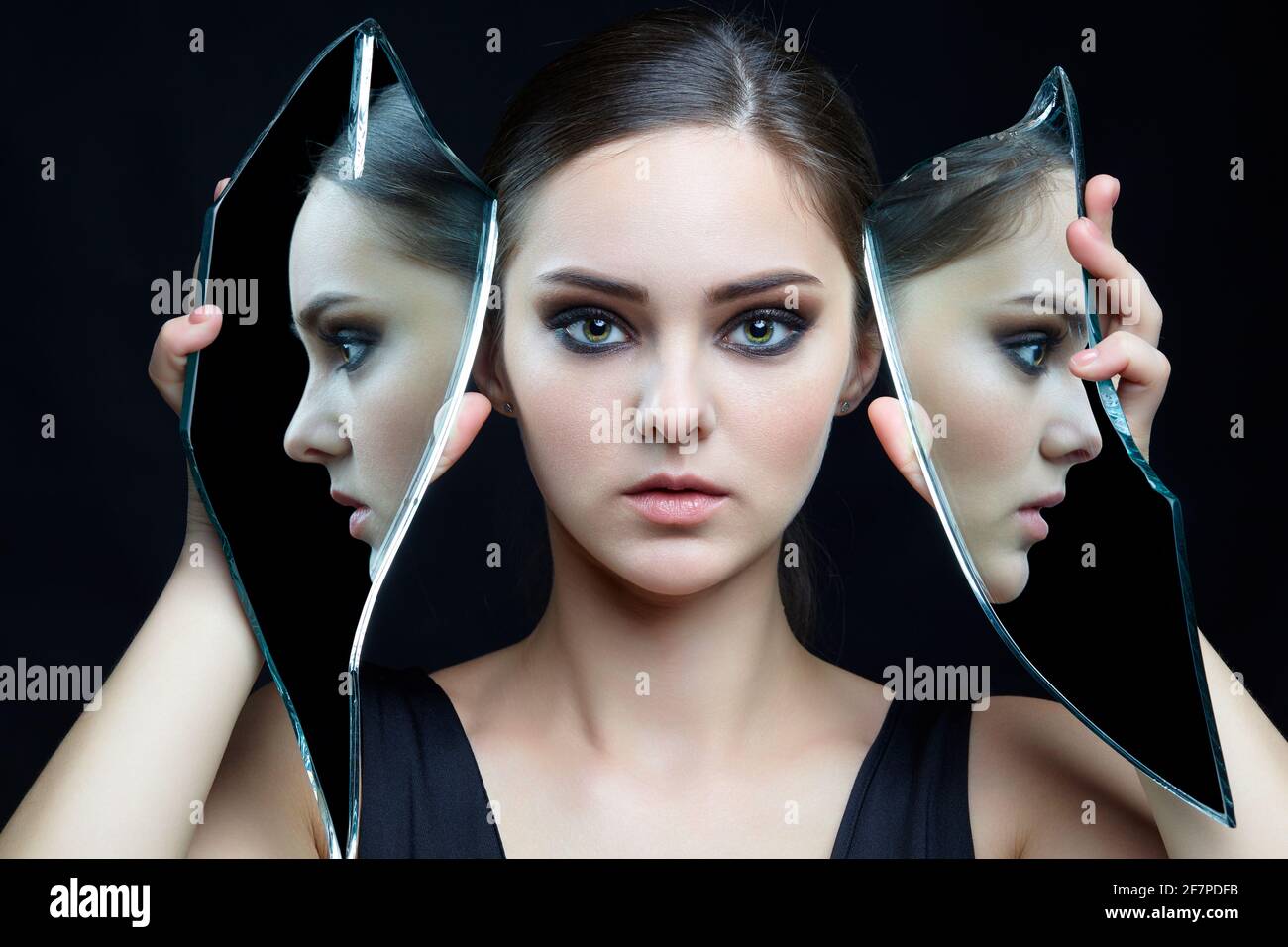 Girl with a shard of the mirror. Female with mirror shard in hand ...