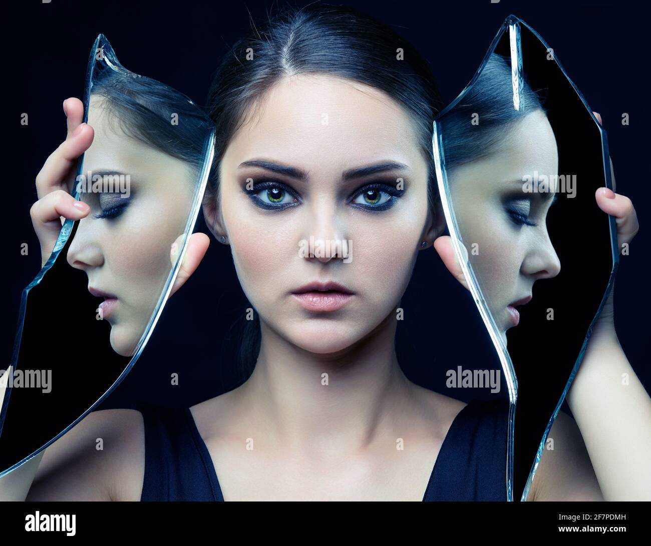 Girl with a shard of the mirror. Female with mirror shard in hand ...