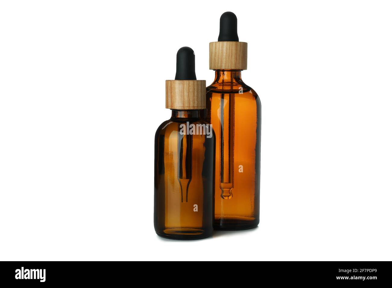 Dropper bottles with oil isolated on white background Stock Photo - Alamy