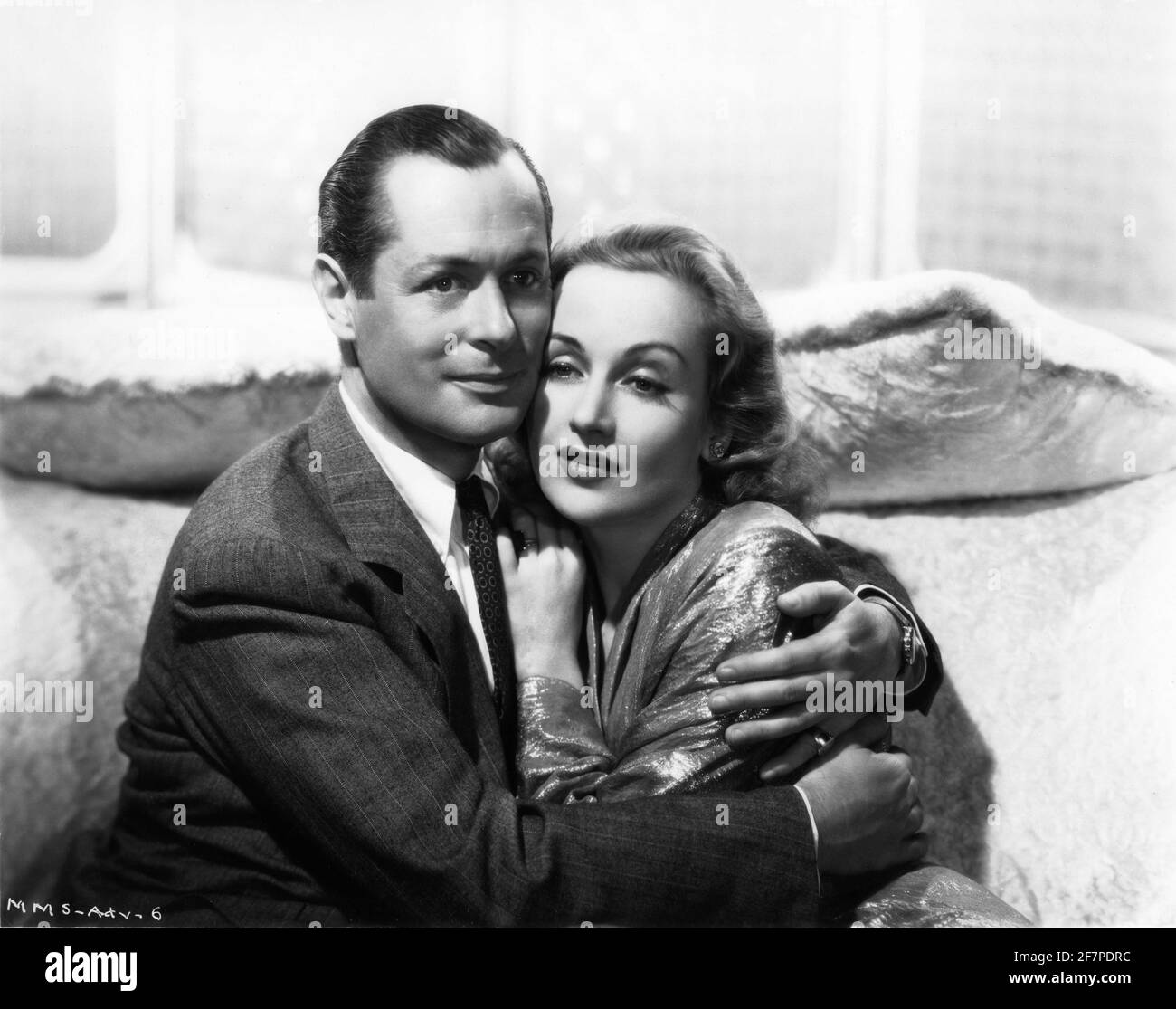 ROBERT MONTGOMERY and CAROLE LOMBARD Publicity Portrait in MR. AND MRS. SMITH 1941 director ...