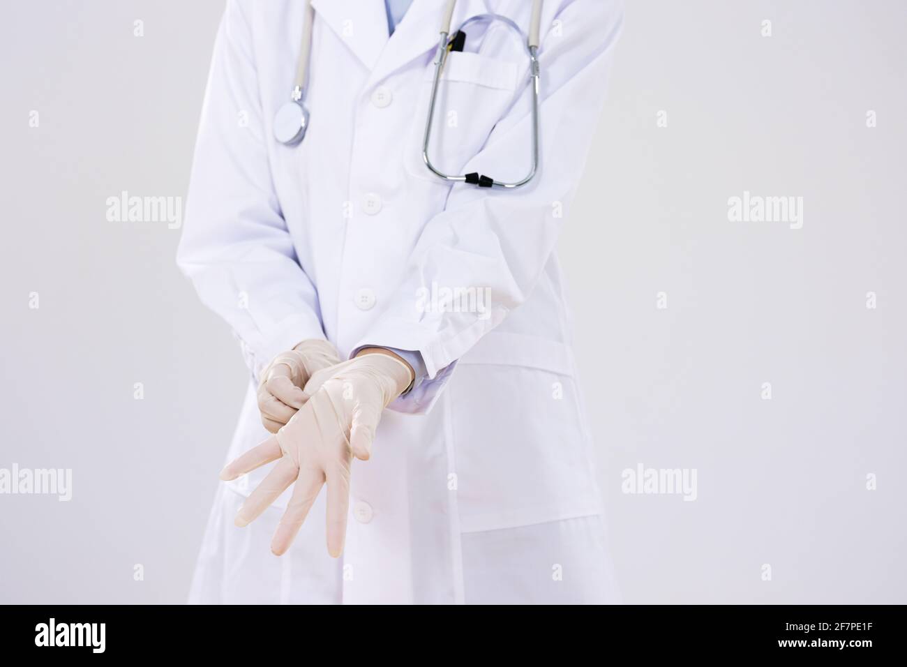 Close up of a female doctor wearing surgical gloves Stock Photo - Alamy