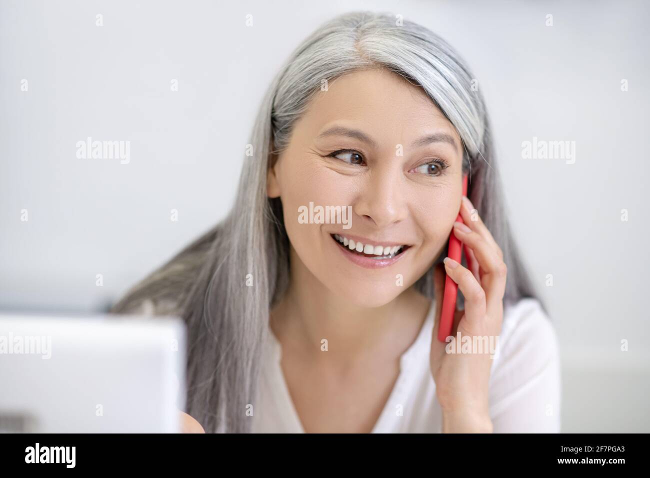 Close up face of woman talking on smartphone Stock Photo - Alamy