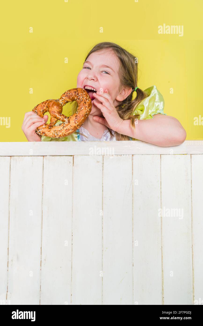 German Bavarian Oktoberfest holiday concept. Funny smile cute little ...