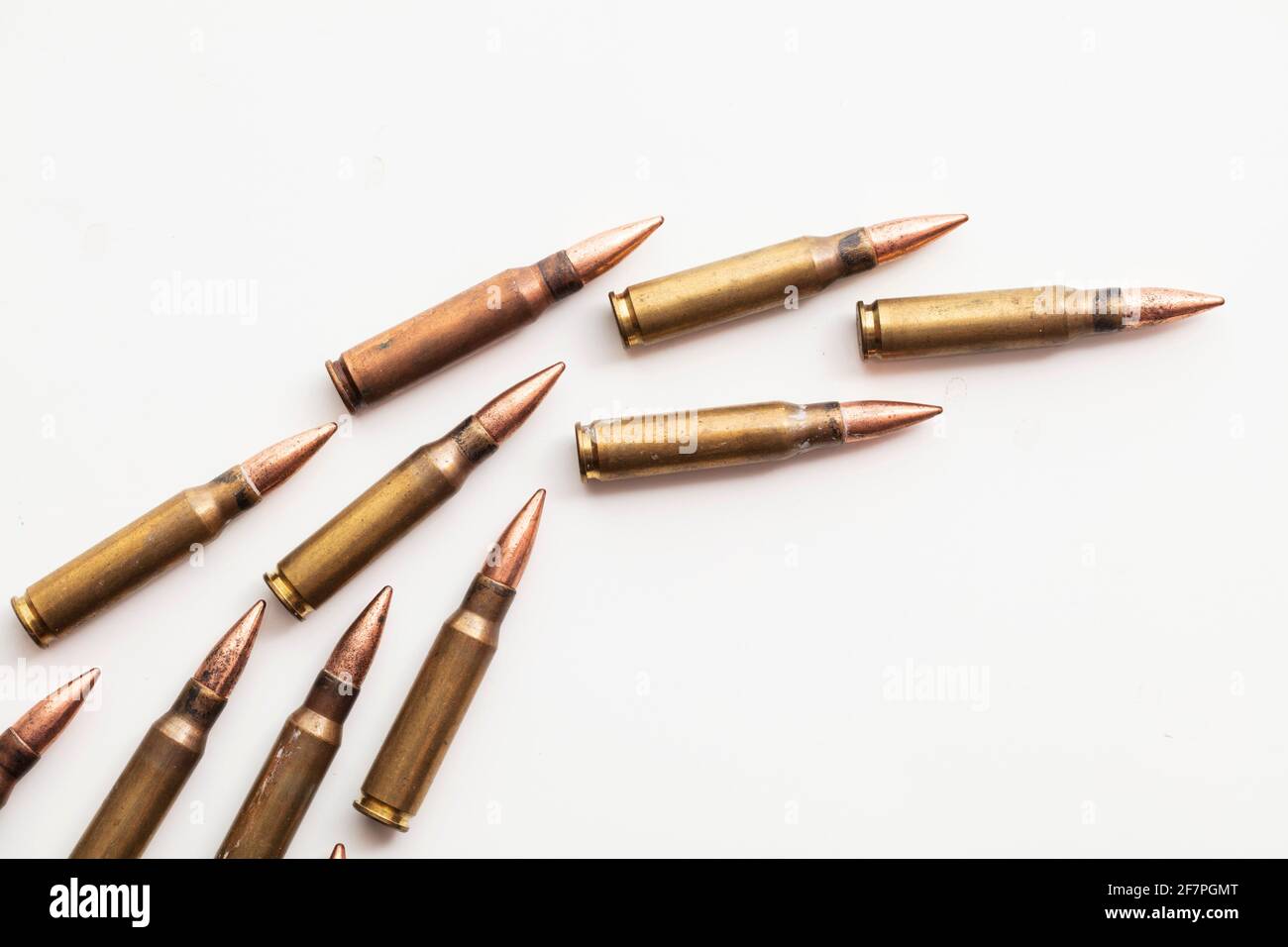 A group of bullet ammunition shells on a white background Stock Photo ...
