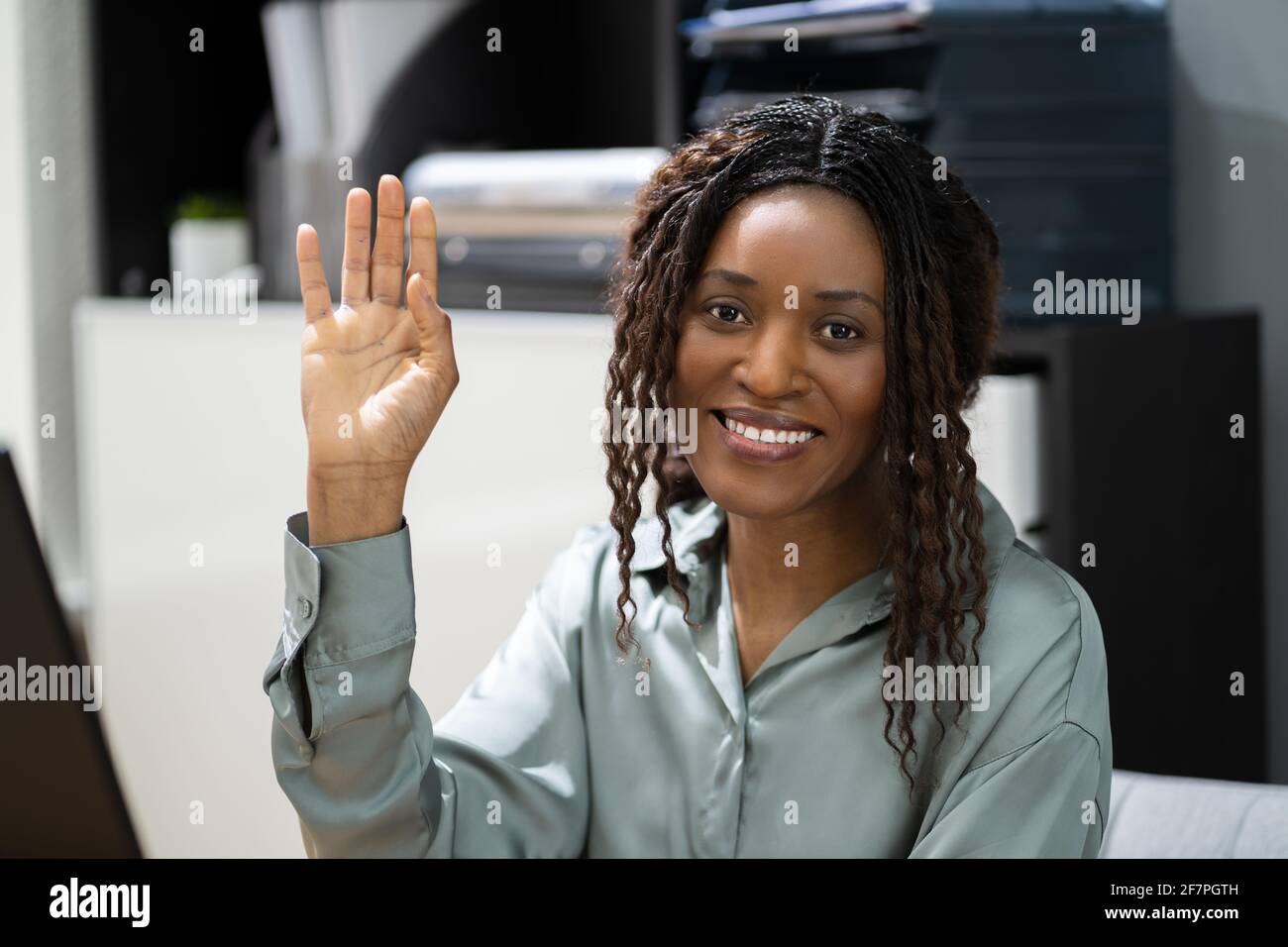 Woman Portrait Waving Hello In Video Conference Stock Photo - Alamy