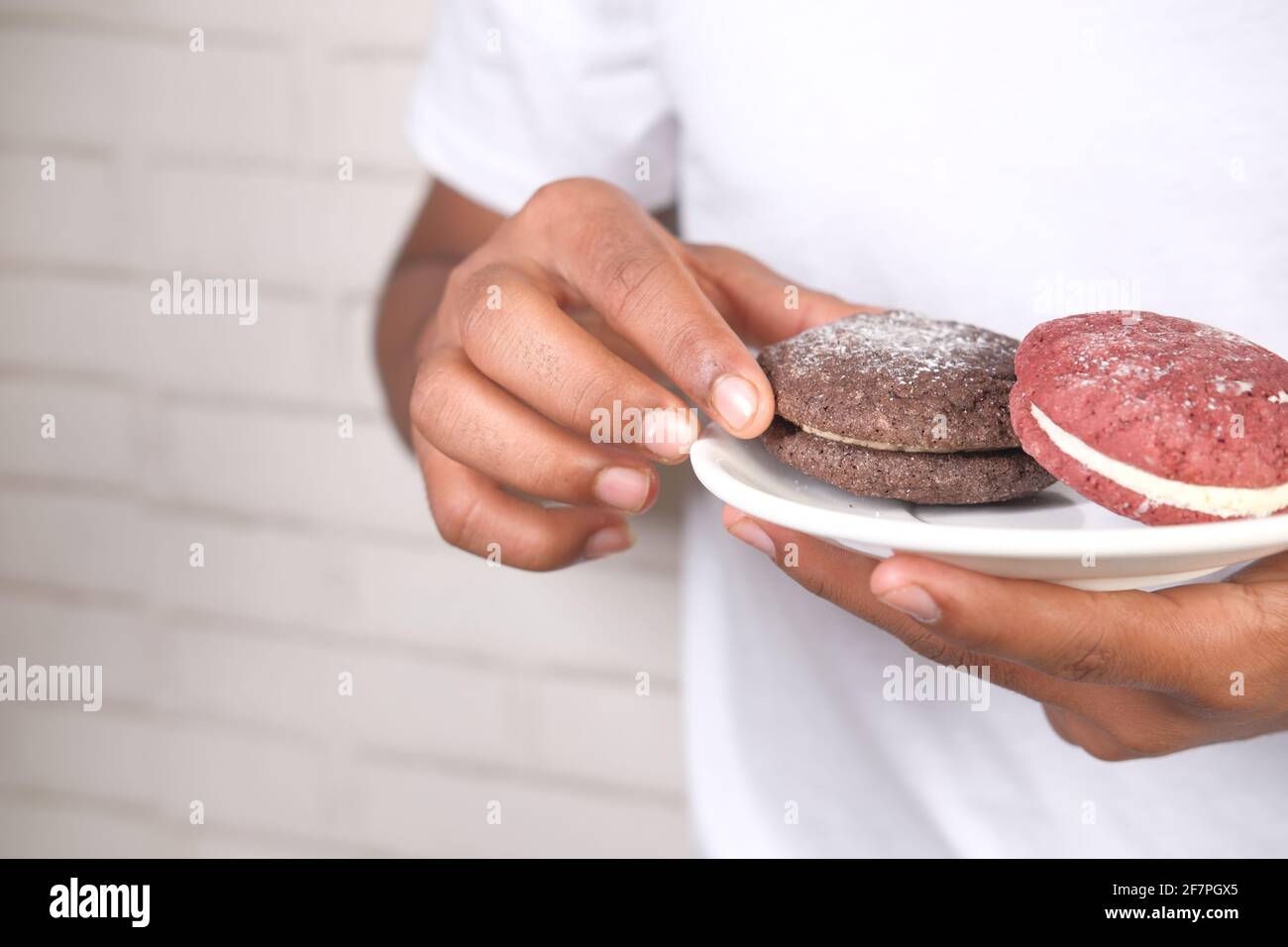 Young man eating sweet chocolate hi-res stock photography and images ...