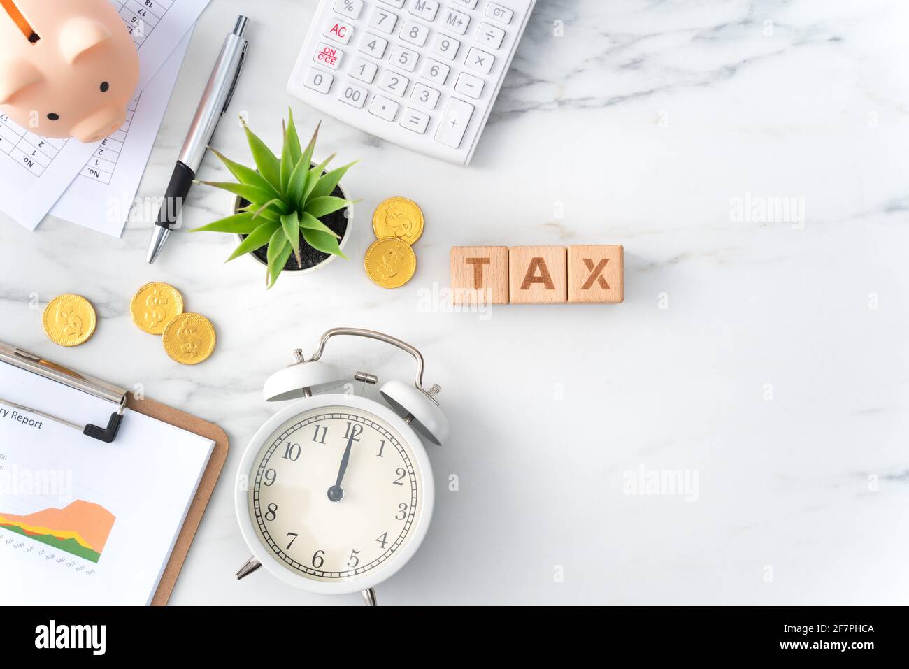 Top view of reading the overview and calculating, paying tax concept on ...