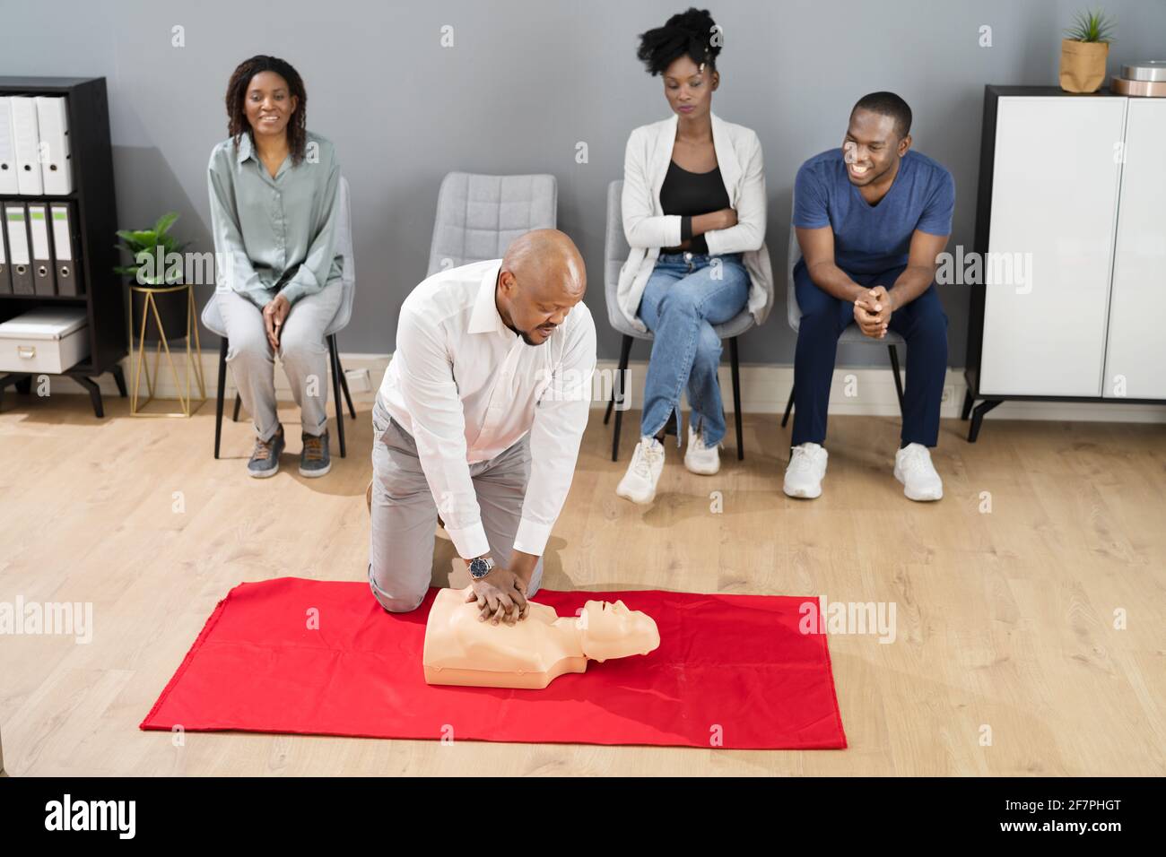 CPR First Aid Lifeguard Or Paramedic Class With African Students Stock ...