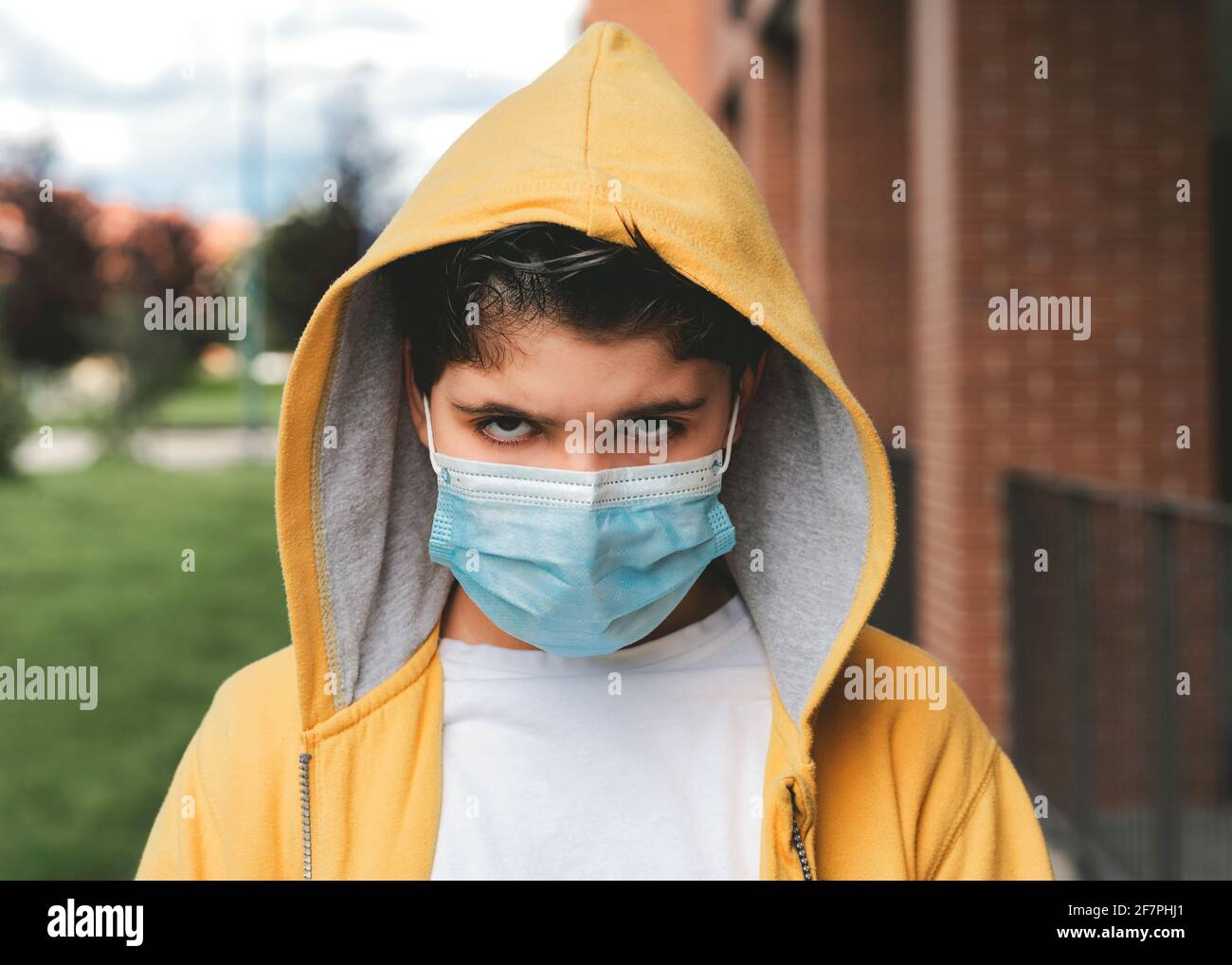 Sad kid medical mask hi-res stock photography and images - Alamy