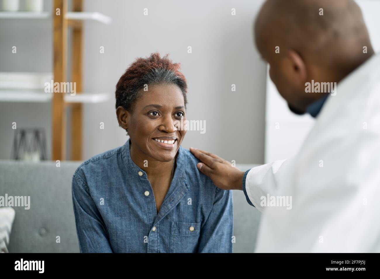 Doctor Talking With Elderly African Patient. Elder Healthcare Stock ...