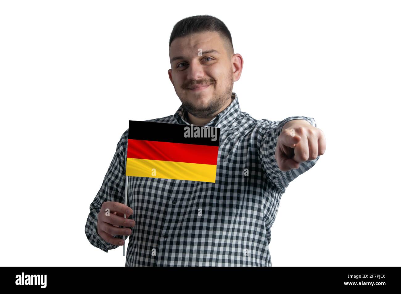 White guy holding a flag of Germany and points forward in front of him ...
