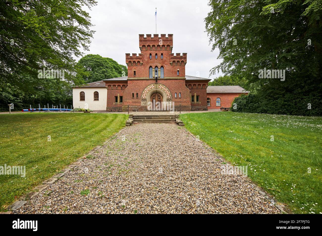 a old red scandinavian building with walking path Stock Photo - Alamy