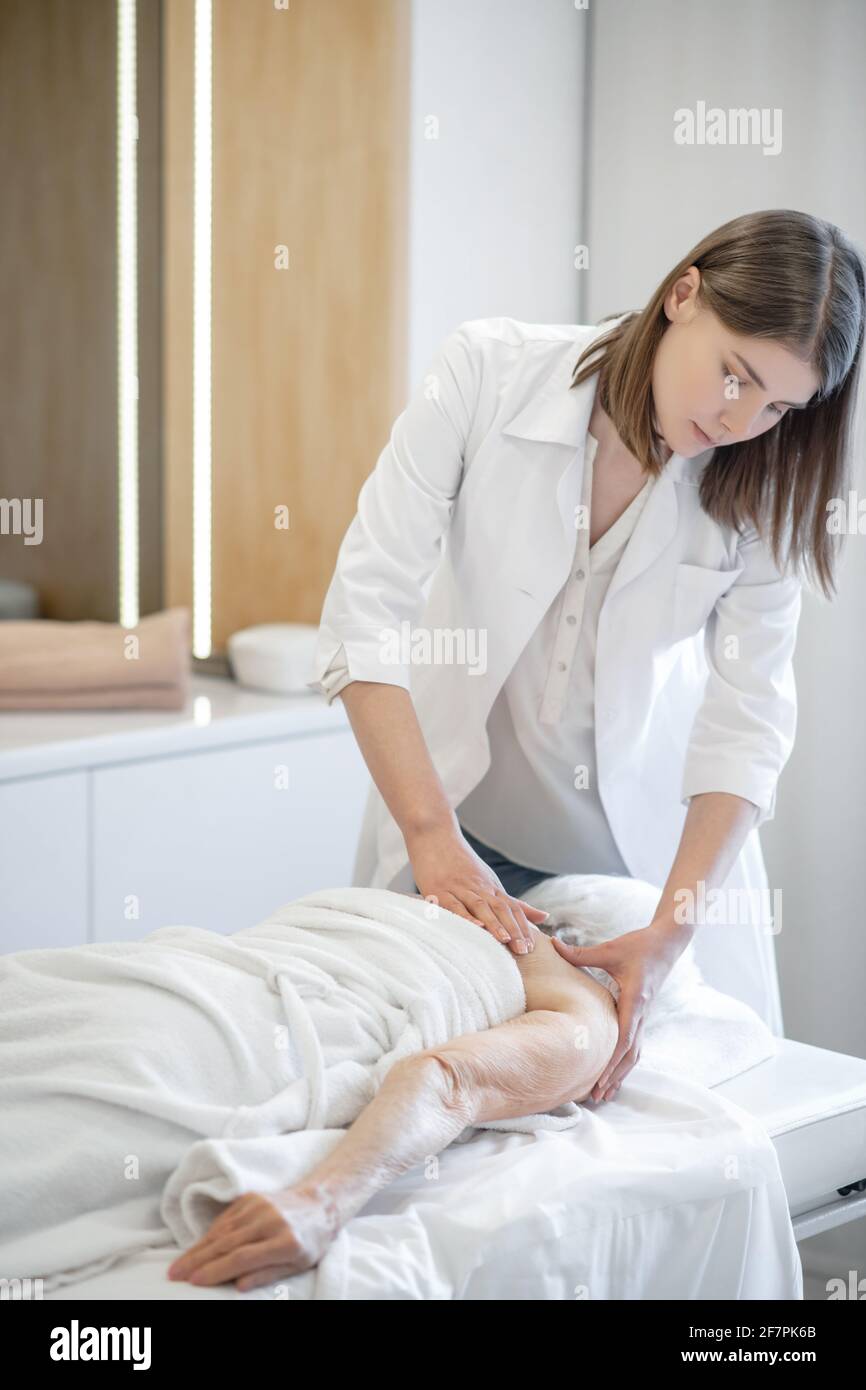Female massage therapist working hi-res stock photography and images ...