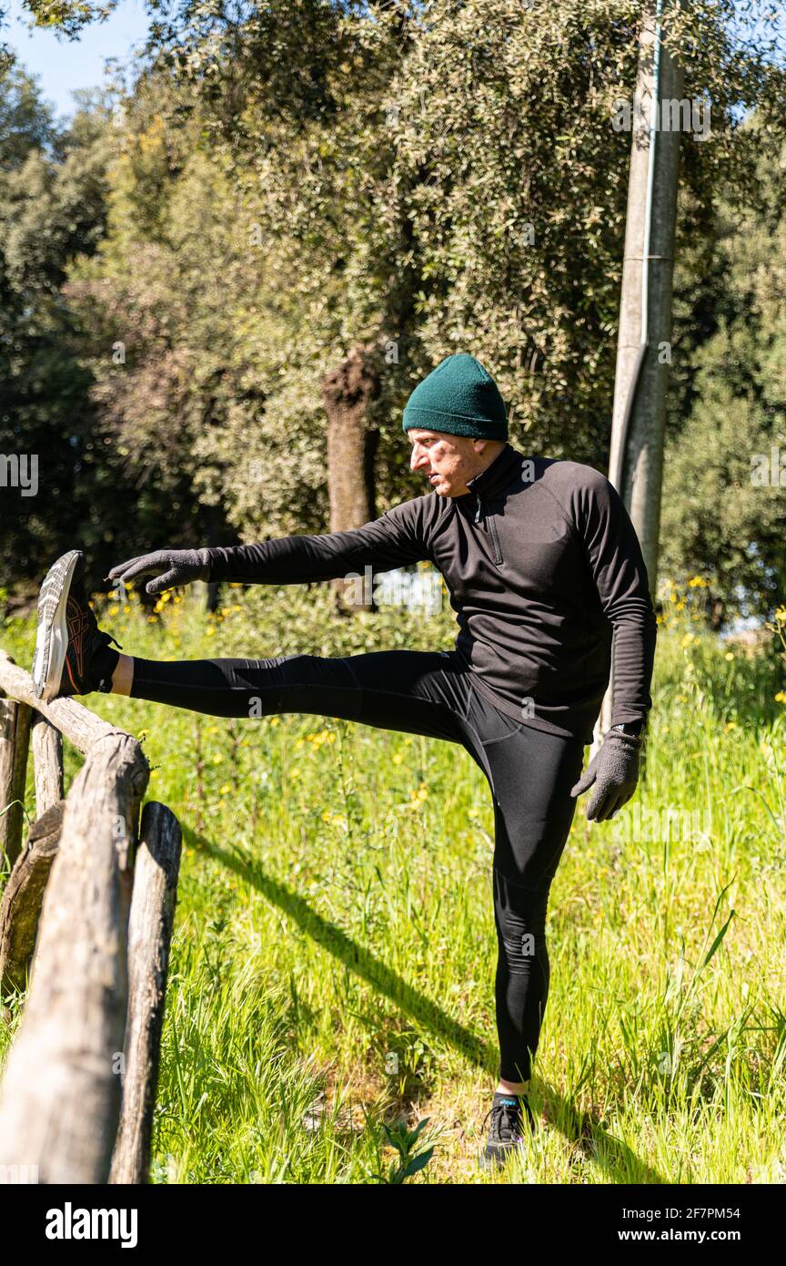 boy does physical activity in the park early in the morning Stock Photo ...