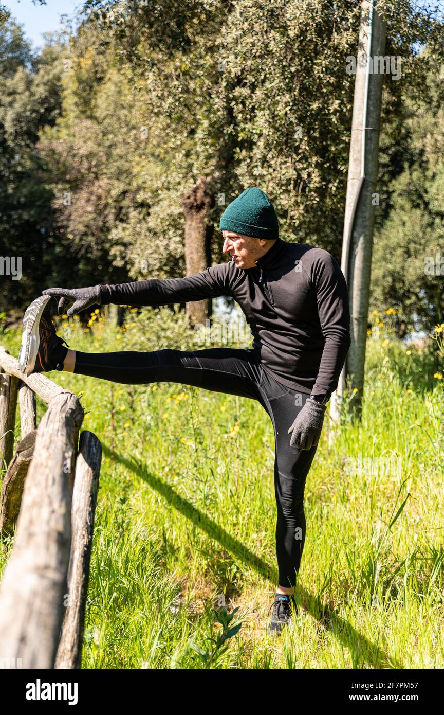boy does physical activity in the park early in the morning Stock Photo ...