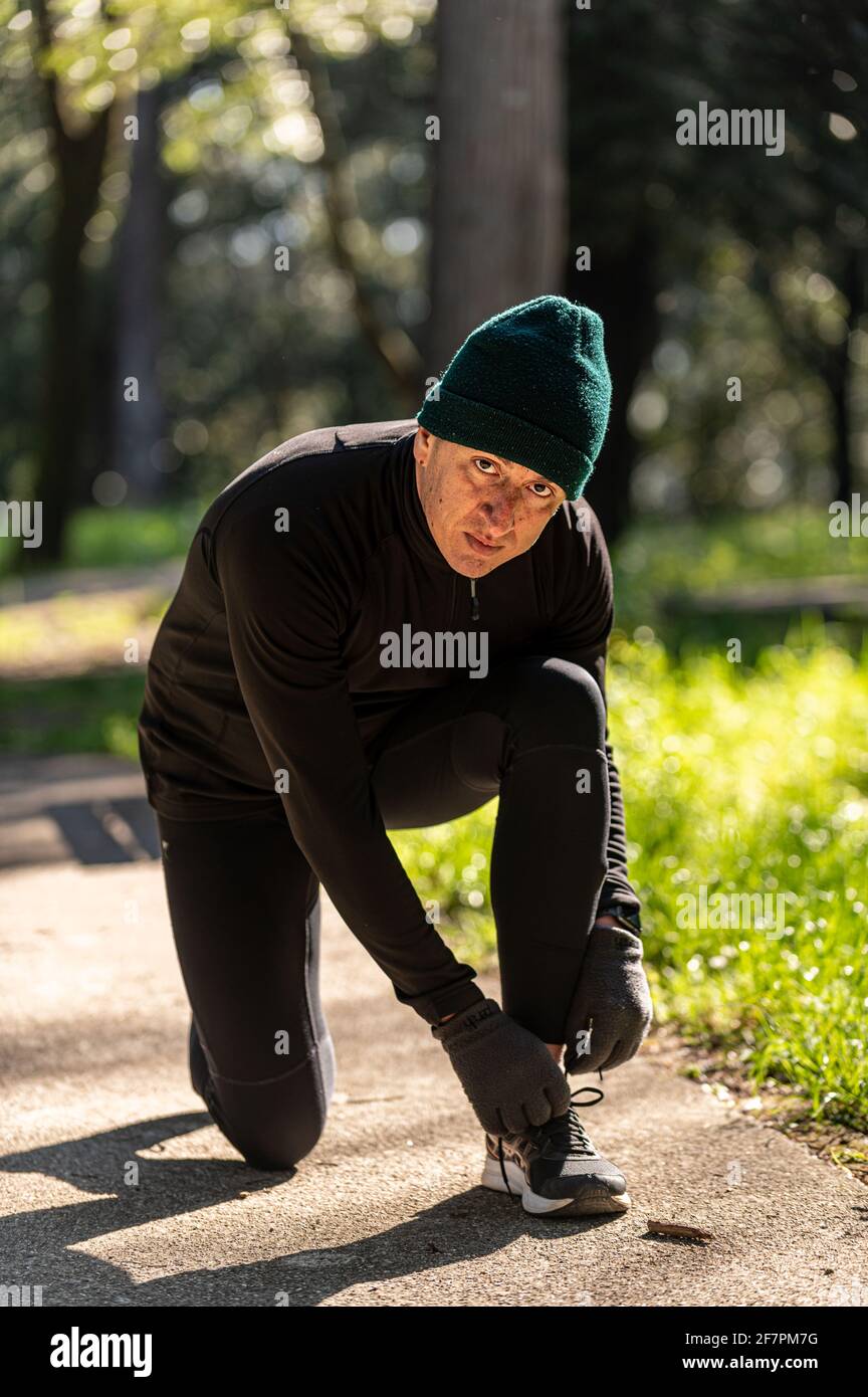 boy does physical activity in the park early in the morning Stock Photo ...