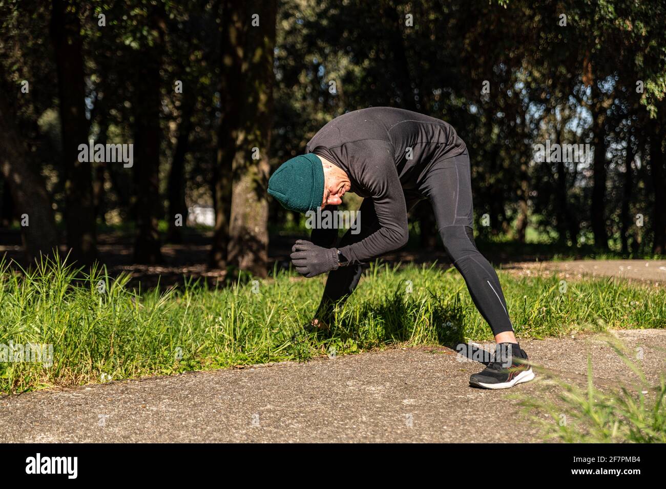 boy does physical activity in the park early in the morning Stock Photo ...