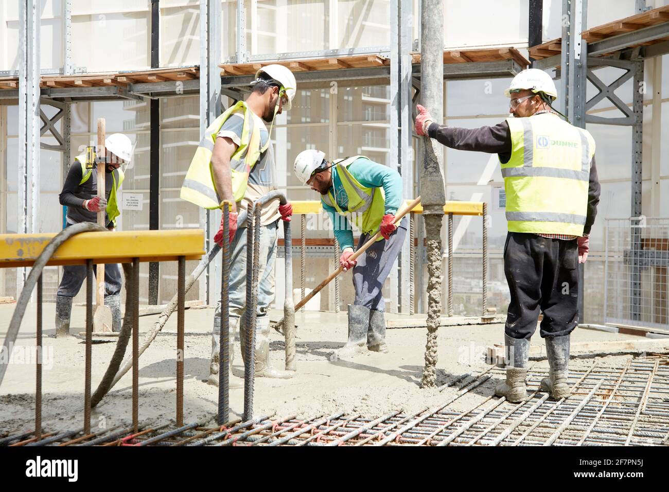 Concrete being poured workers high hi-res stock photography and images ...