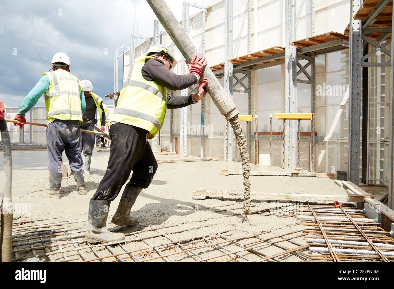Concrete being poured workers high hi-res stock photography and images ...