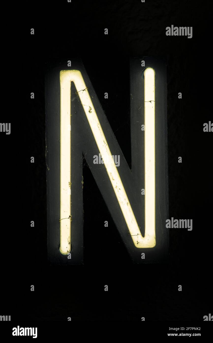 White neon letter N in the dark Stock Photo - Alamy