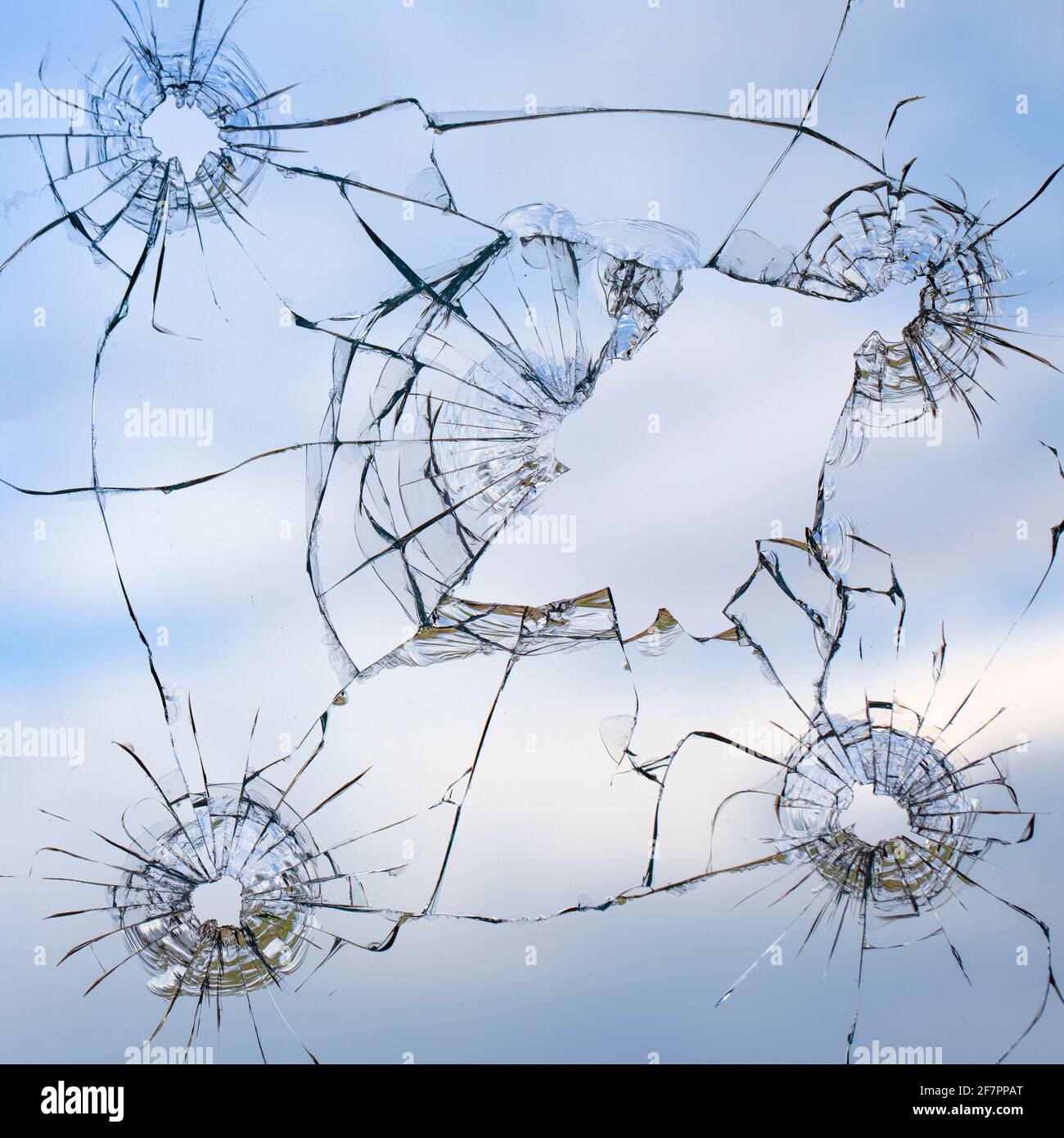 Broken window glass on a background of blue sky Stock Photo - Alamy