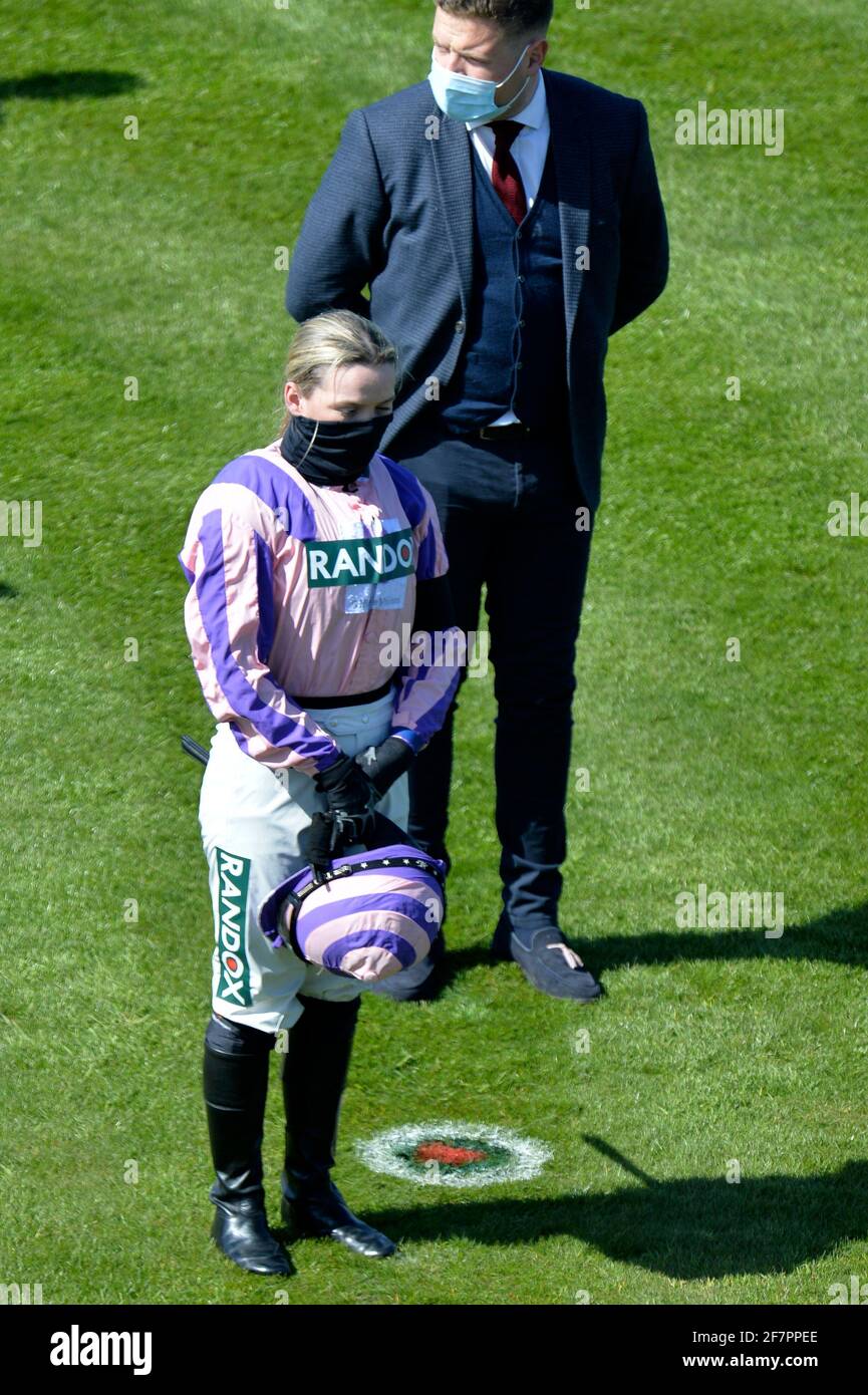 Jockey Isabel Williams stands for a minutes silence in the parade ring ...