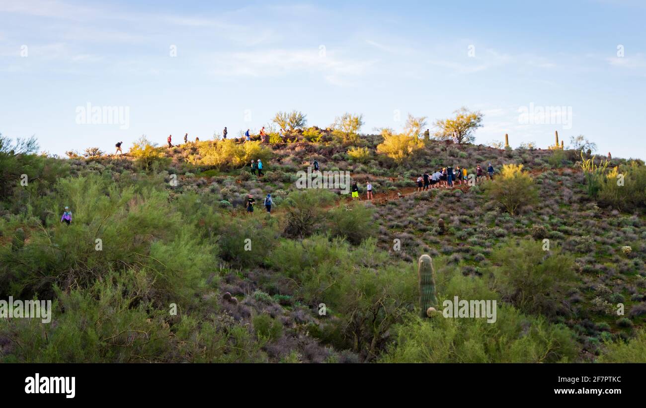 People hiking and running up and down Apache Wash Trail, Phoenix ...