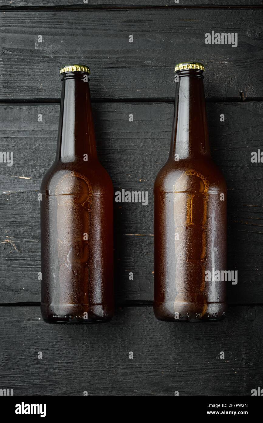 Beer bottle set, on black wooden background, top view flat lay Stock ...