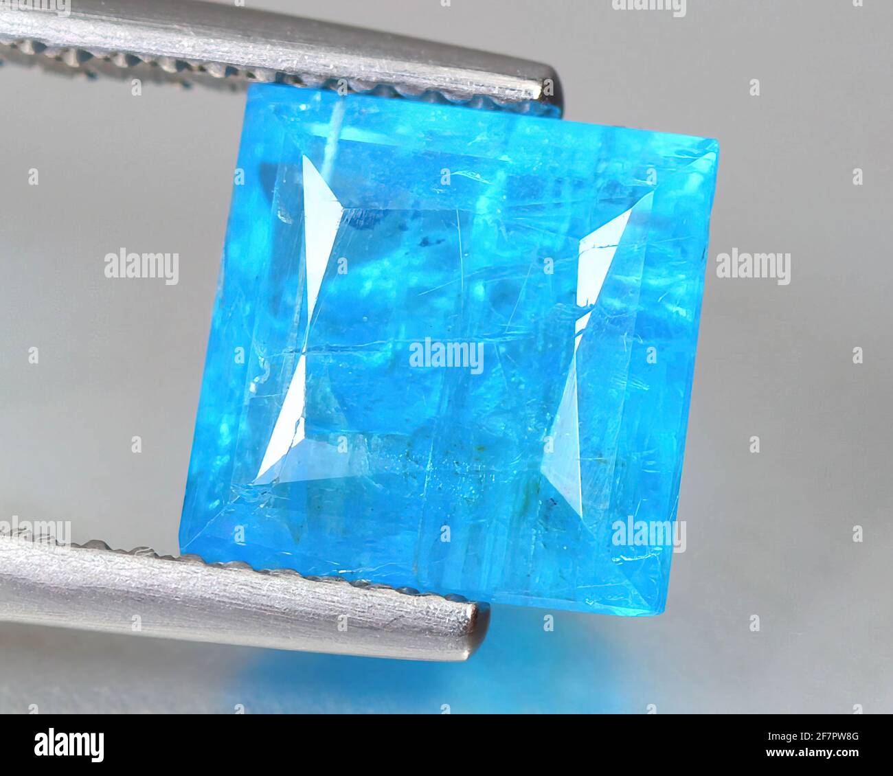Natural gemstone blue neon apatite on background Stock Photo - Alamy